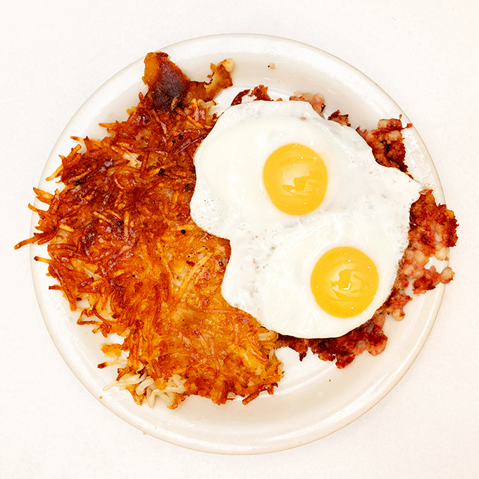 Crispy hash browns and sunny-side-up eggs&mdash;the breakfast equivalent of a perfect sunrise, where every bite delivers that satisfying crunch-to-gooey ratio.