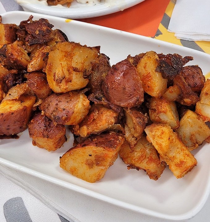 Home fries that achieve the impossible trifecta: crispy edges, tender centers, and seasoning that makes salt shakers jealous.
