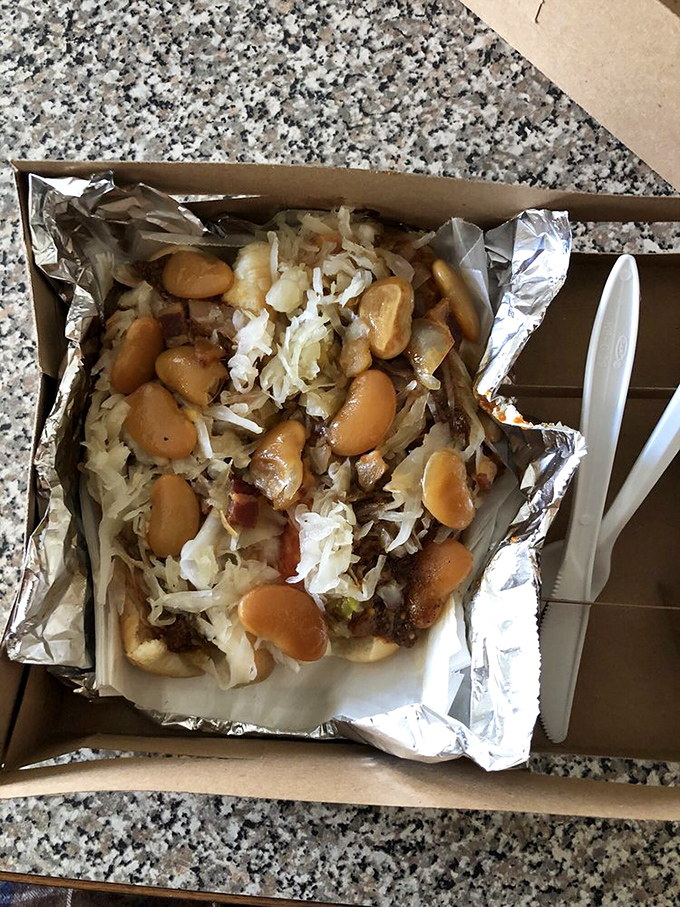 Hot dog architecture at its finest. The foundation: a soft bun. The masterpiece: beans, kraut, and meat working in perfect harmony.