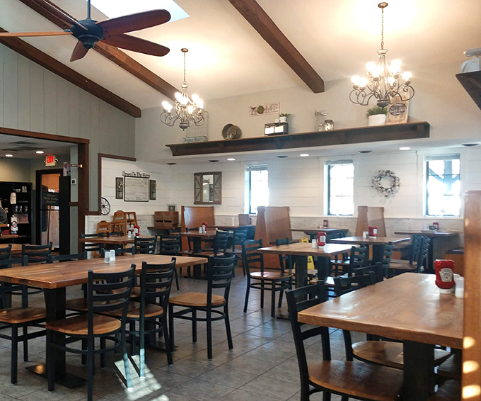 A dining room where chandeliers meet ceiling fans in perfect harmony. Farmhouse elegance without a hint of pretension.