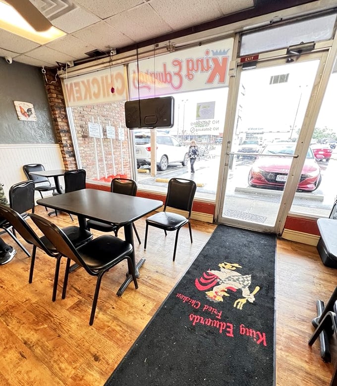 Simple tables, basic chairs, and a floor mat that proudly declares their chicken allegiance. Sometimes the best dining rooms skip the chandelier.