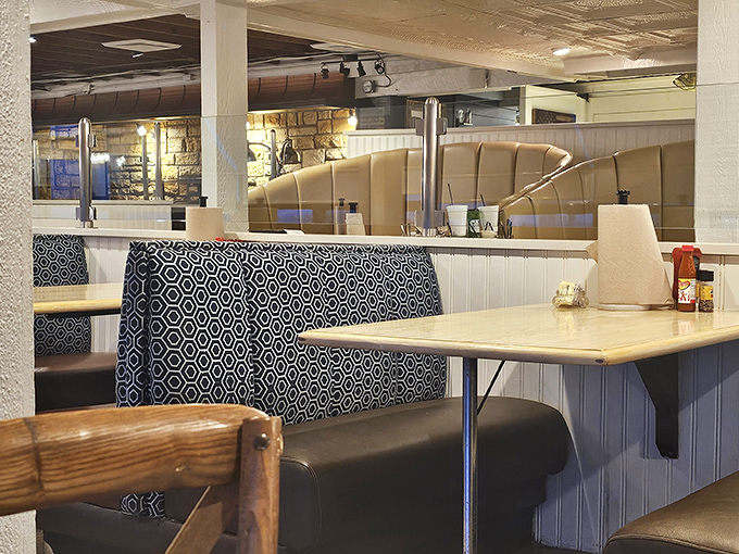 Navy blue booths and wooden accents create that perfect "maritime-meets-homestyle" vibe that says, "Yes, we take our seafood seriously, but not ourselves."
