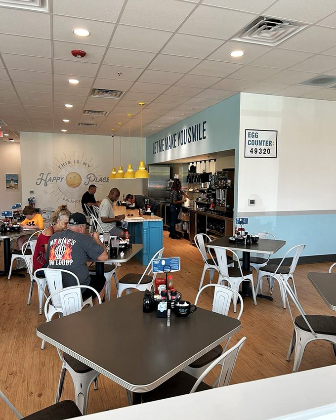 Let me make you smile isn't just wall art—it's a breakfast mission statement. That sunny yellow lighting is doing its part before the coffee even arrives.