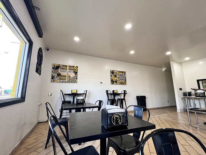 Clean lines, simple tables, and zero distractions from the main event. This is chicken theater, and you've got front-row seats.