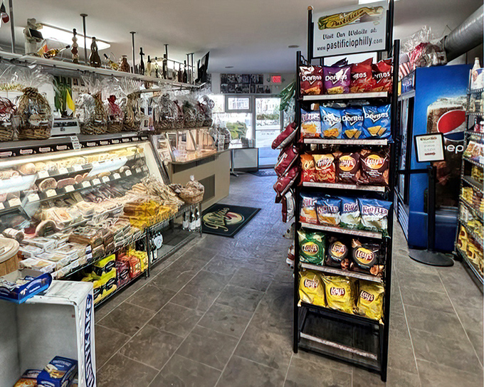 The deli case and chip display&mdash;a supporting cast that deserves its own spin-off. Italian market essentials within arm's reach.