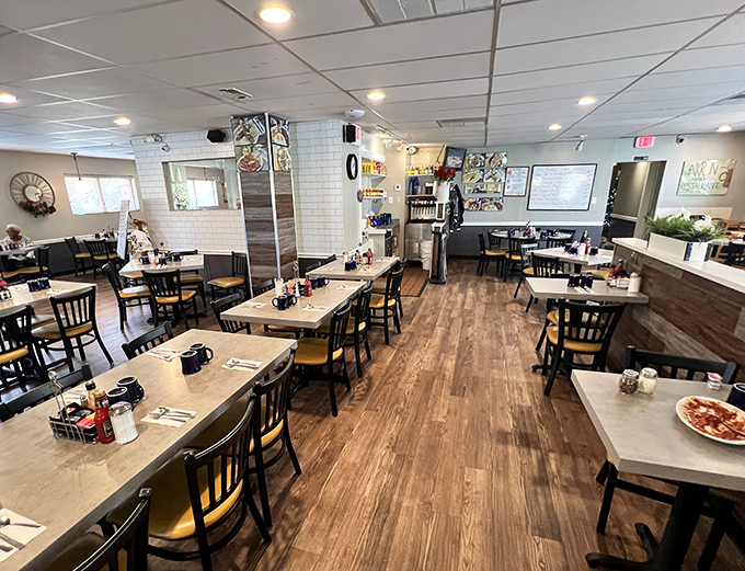 The dining room—where wooden floors and white tables create the backdrop for countless "remember that breakfast we had in Akron?"