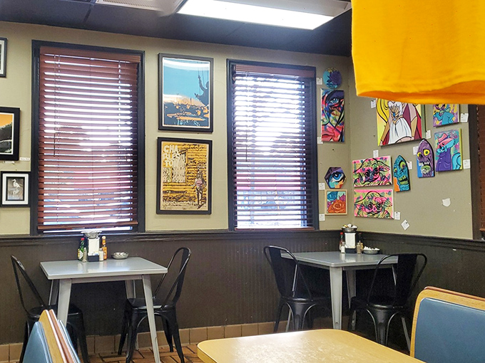 Local art brightens the walls while natural light streams through wooden blinds. This isn't decoration&mdash;it's a gallery where the admission price is a great meal.