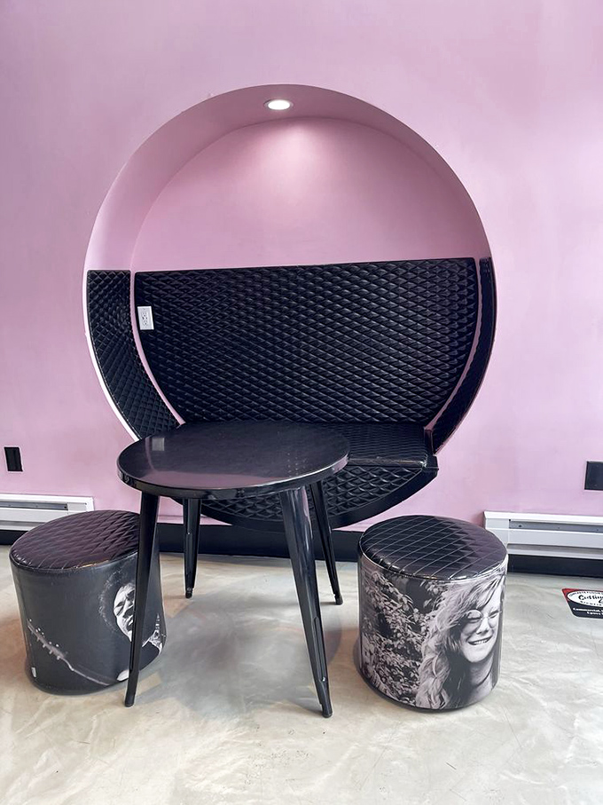 The circular booth creates a pink cloud sanctuary where music legends might have plotted their next albums&mdash;if they'd lived to enjoy good coffee.