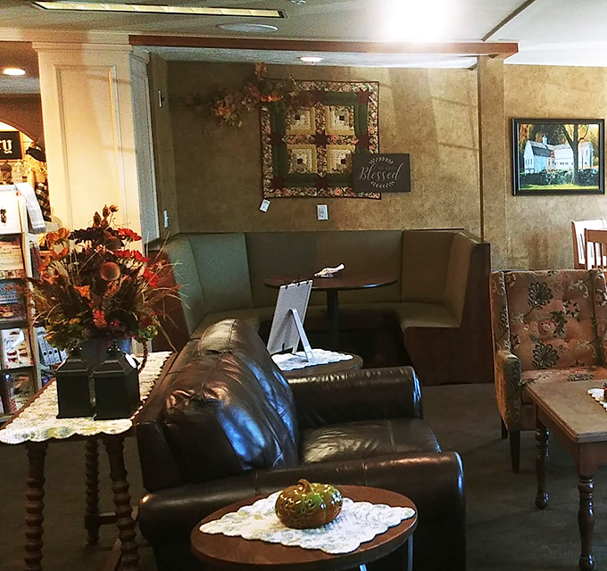 The cozy seating area offers a moment of respite, where vintage-inspired furniture invites weary shoppers to rest before the next round of Amish country exploration.