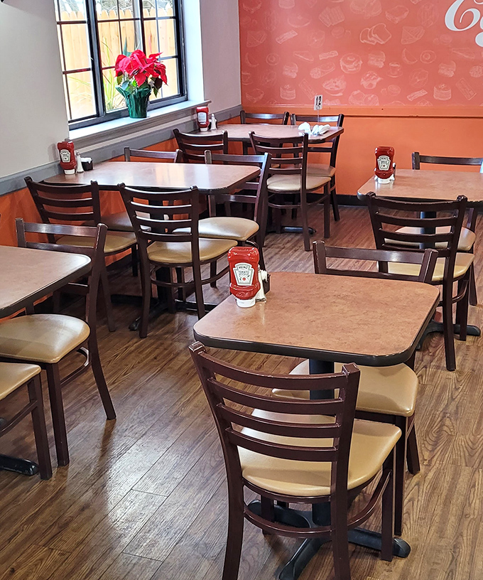 No Edison bulbs or exposed ductwork here—just honest tables, chairs that don't require an engineering degree to sit in, and ketchup within reach.