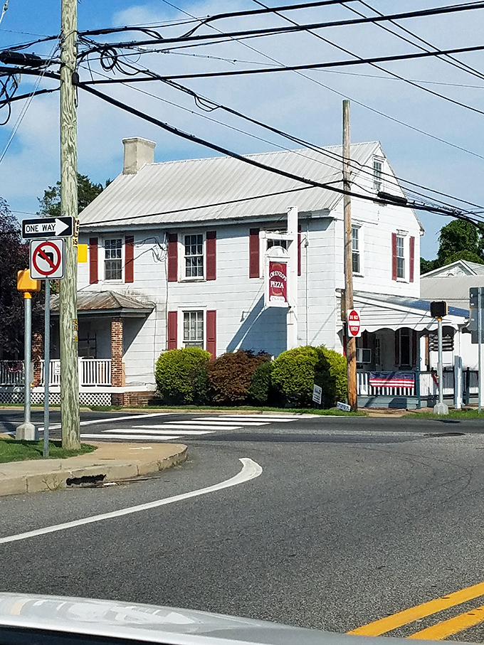 This stately brick building anchors a key intersection in Odessa's historic district, its Georgian symmetry a hallmark of colonial design.