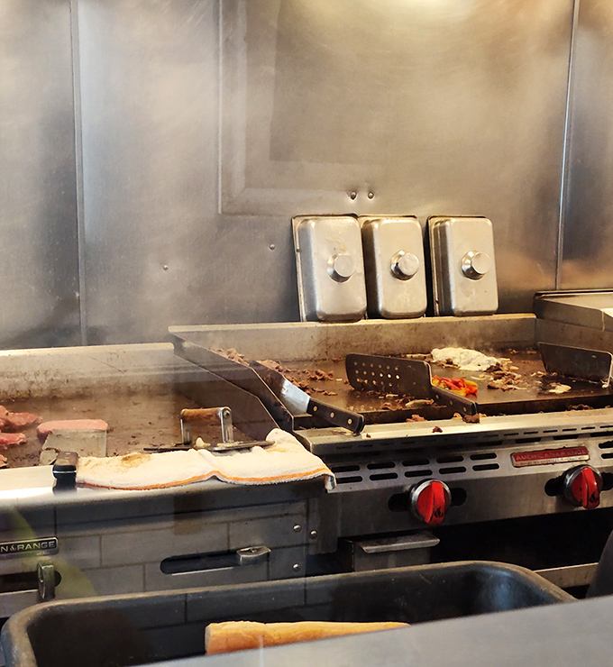 The battlefield where cheesesteak magic happens. Those spatulas have probably logged more miles than most Fitbit users.