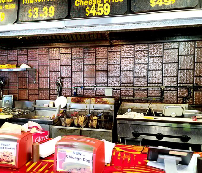 Behind the scenes where the magic happens: the well-worn kitchen tells stories of countless hot dogs that have made Miami happier.