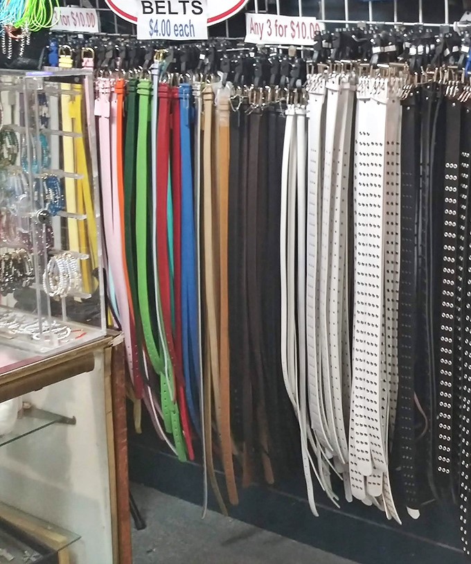 A rainbow of leather belts dangles in chromatic temptation. At these prices, the question isn't "Should I?" but rather "Which color first?"