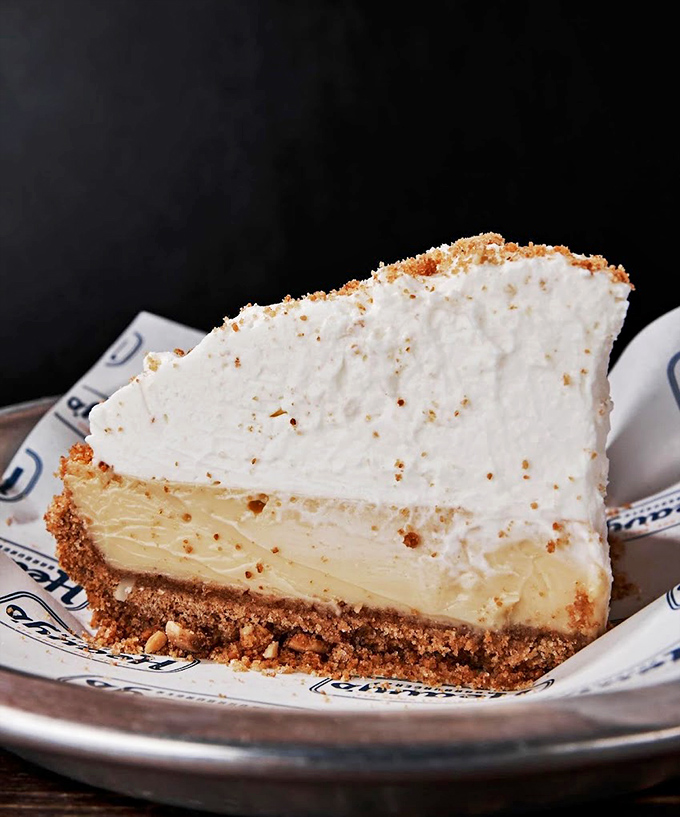 A slice of pie that makes you understand why people write songs about dessert. The cloud-like topping and graham cracker crust create a perfect harmony.