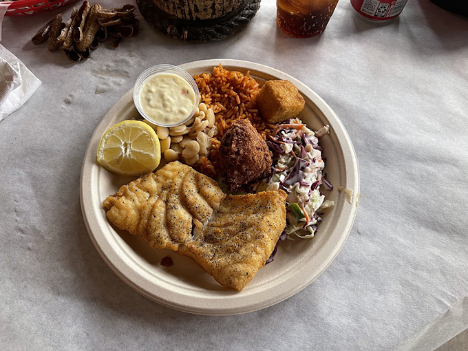 A perfectly cooked piece of fish surrounded by the holy trinity of Lowcountry sides: red rice, lima beans, and slaw that's neither too sweet nor too tangy.