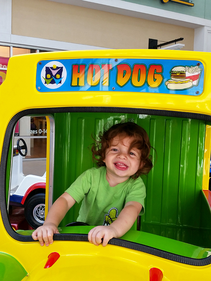 Kid-friendly ride-on attractions keep the little ones entertained while you contemplate whether you really need another handbag. (Spoiler: you do.)