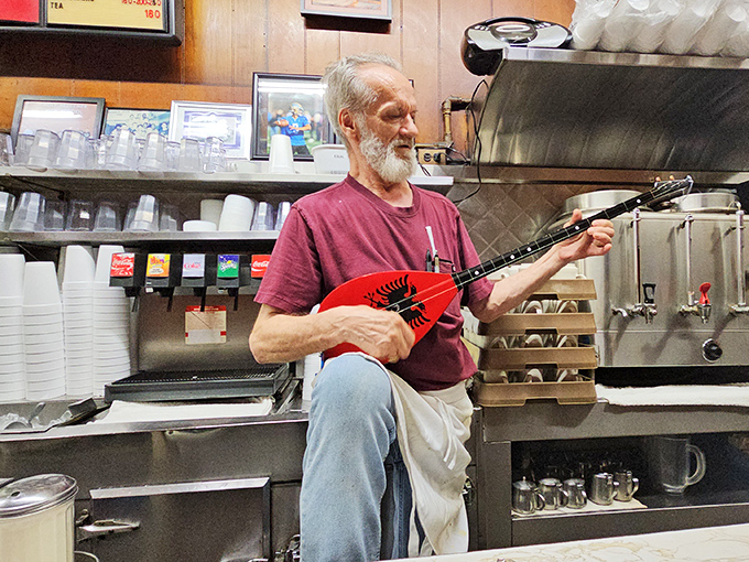Between orders, unexpected moments of joy emerge. This gentleman's mandolin reminds us that nourishment comes in many forms.