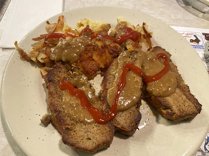 Meatloaf that would make your grandmother nod in approval, swimming in gravy that demands to be sopped up with every last potato morsel.