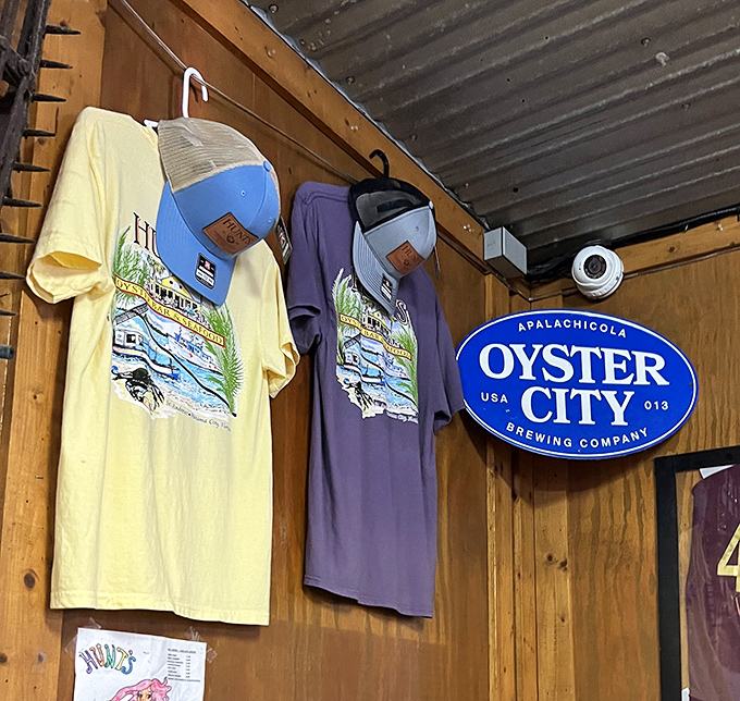 The merch wall says, "Yes, you'll want to remember this place." The Oyster City sign reminds you exactly where these treasures come from.