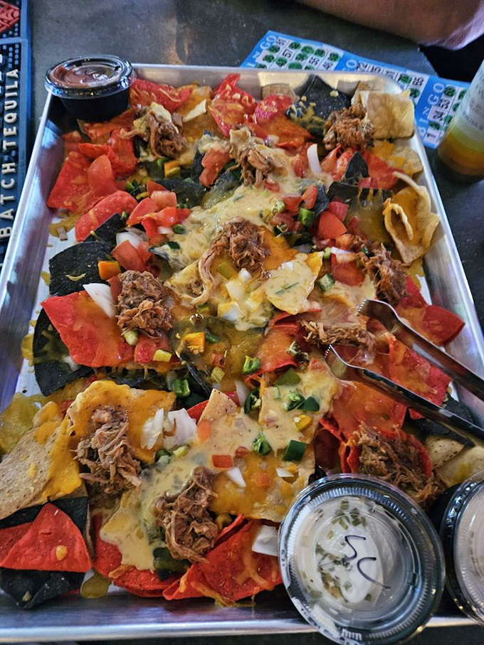 BBQ nachos that blur the line between appetizer and main course—a mountain of flavors that's worth every messy bite.