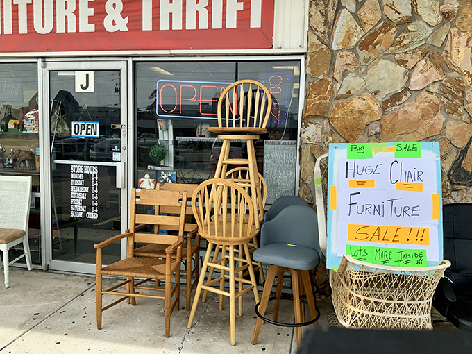 The sidewalk preview is like a furniture appetizer &ndash; those wooden chairs stacked with possibility and that handwritten sale sign promising more inside.