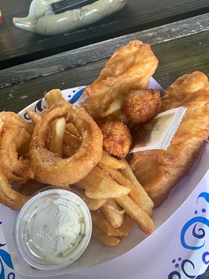 Onion rings with the structural integrity of Olympic medals, yet delicate enough to shatter with one satisfying bite.