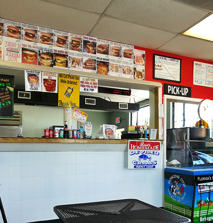 The order counter wall of fame showcases every possible combination of deliciousness – a roadmap to happiness printed on red and white.