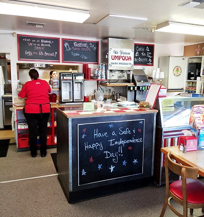 The heart of operations: where burger dreams are born and Facebook specials are announced with chalk-written flair.