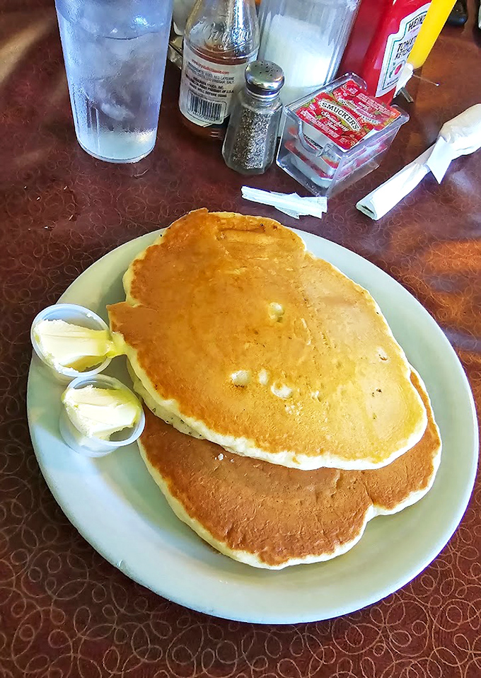 These pancakes aren't just breakfast &ndash; they're golden discs of possibility, waiting for butter to perform its melting magic.