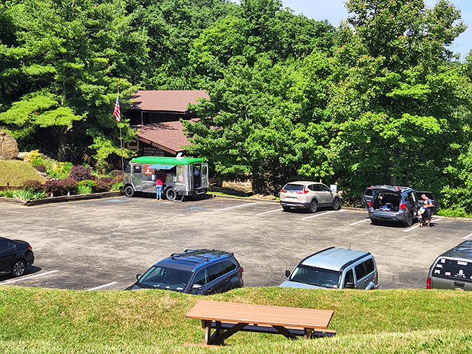 The parking area might seem ordinary, but it's the launching pad for extraordinary adventures. That food truck suggests someone brilliantly recognized hungry explorers need refueling.
