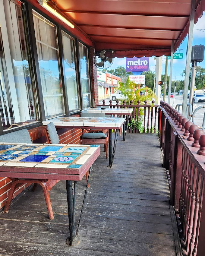 The outdoor patio offers a sunny respite where mosaic tables add a touch of artistry to your morning coffee ritual.
