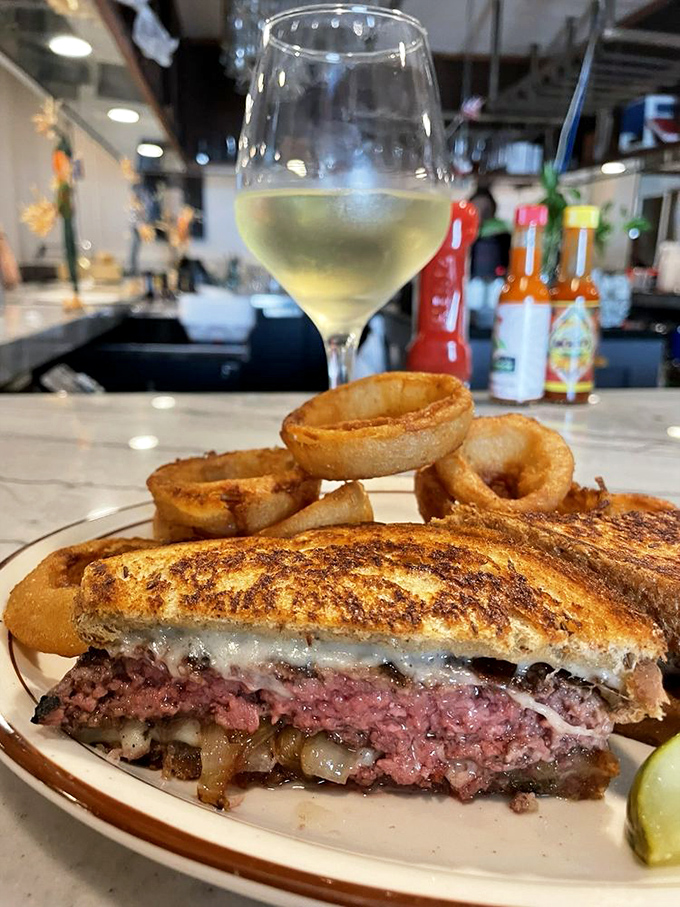 This patty melt isn't just a sandwich&mdash;it's an architectural achievement. The melted cheese and caramelized onions create a symphony of savory satisfaction.