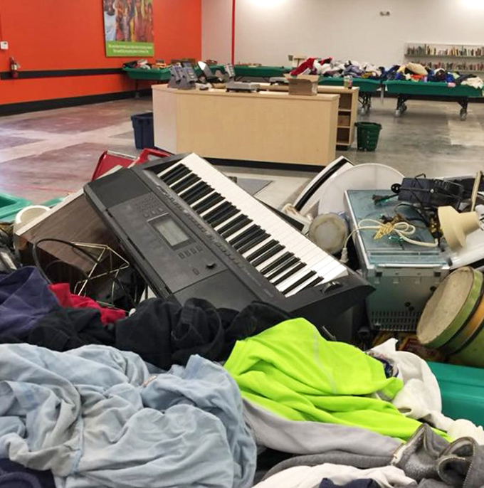 A keyboard emerges from the textile sea like a musical island, promising symphonies for someone with the vision to rescue it.