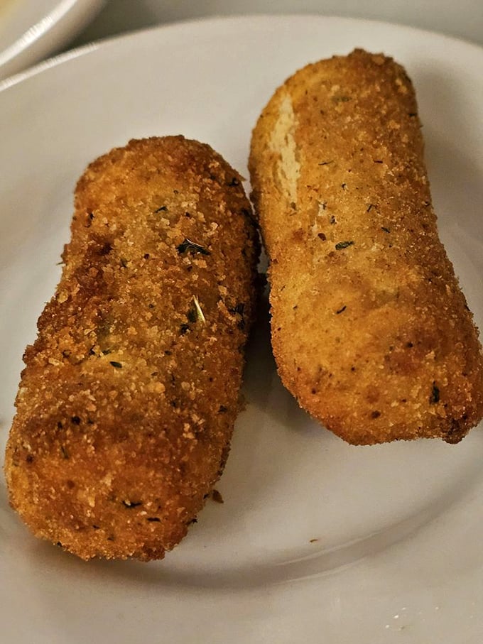 Golden-brown potato croquettes that crunch like autumn leaves, revealing a creamy interior that makes mashed potatoes seem like they're not even trying.