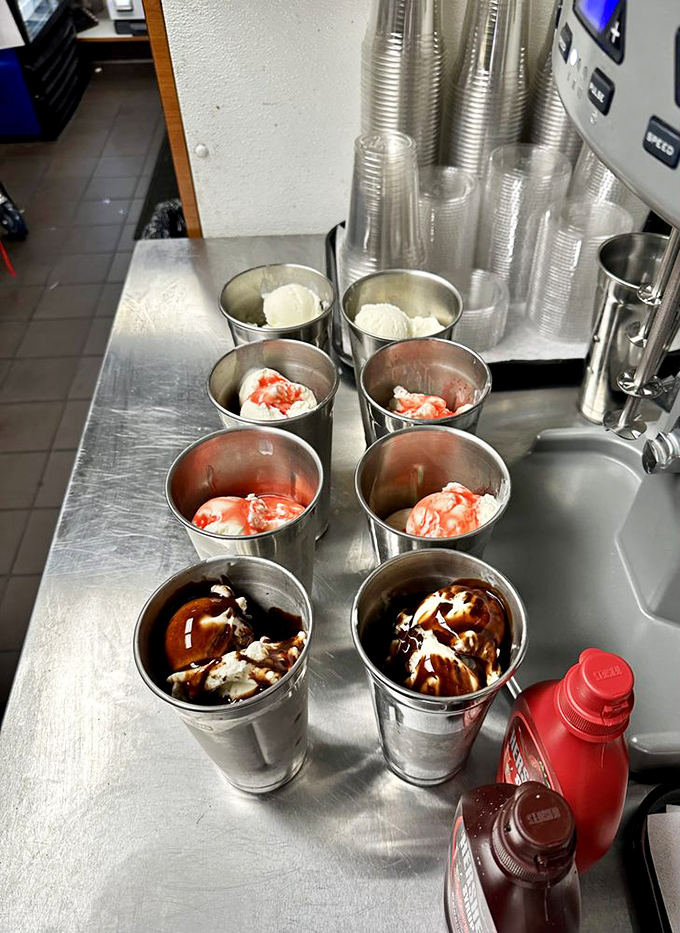 Milkshake mise en place&mdash;the behind-the-scenes magic where ice cream dreams come true. Each metal cup holds potential happiness.