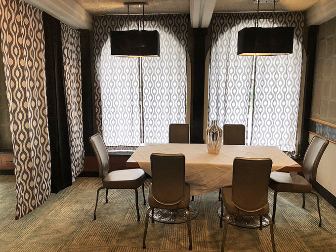 The private dining area offers a touch of mid-century modern elegance with patterned curtains and clean lines &ndash; perfect for family celebrations or clandestine business deals.