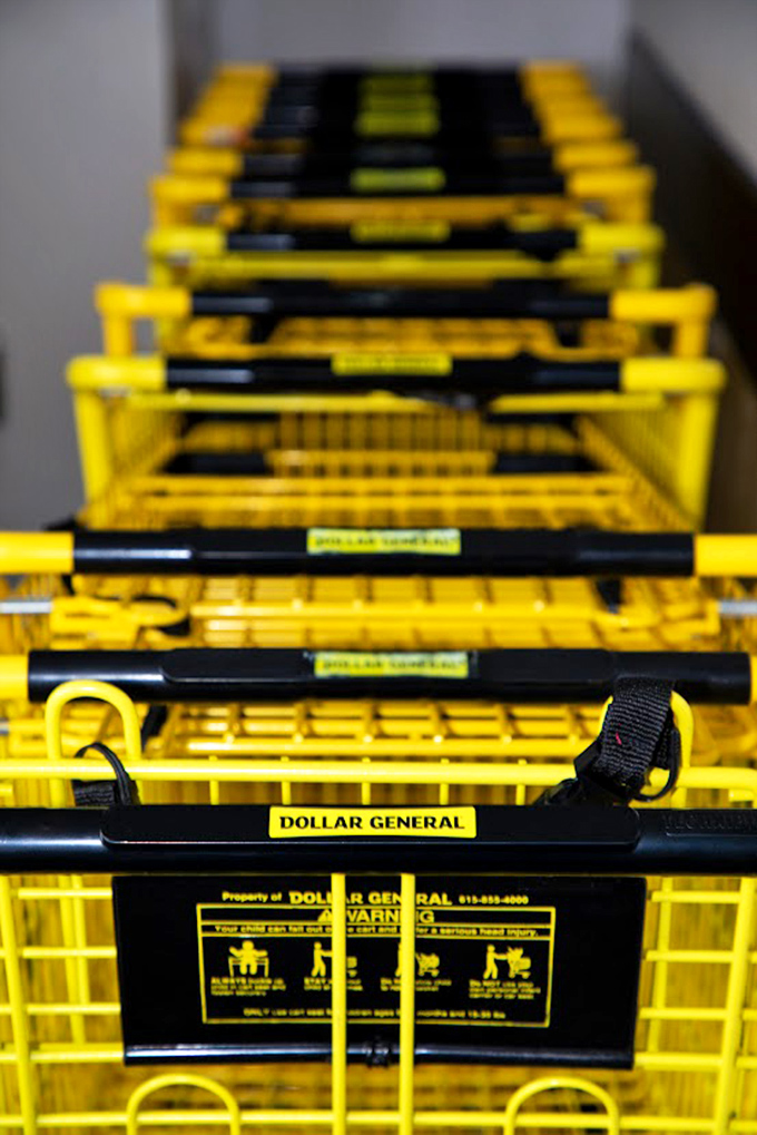 The yellow shopping carts line up like eager soldiers, ready to be filled with more items than you originally planned.