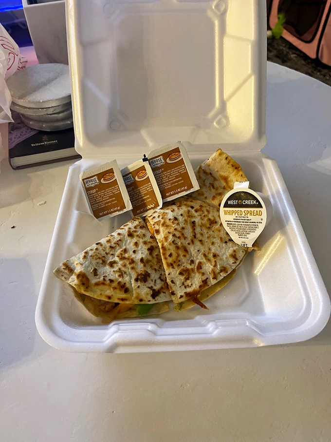 That quesadilla in its to-go container looks like it's ready for a midnight rendezvous. Late-night cravings have met their match.
