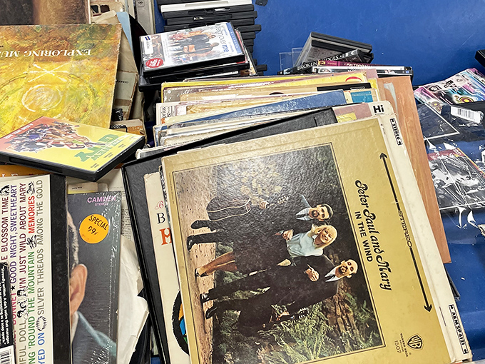 Vinyl treasures nestled together like old friends at a reunion. Each album cover art tells a story before the needle even drops.