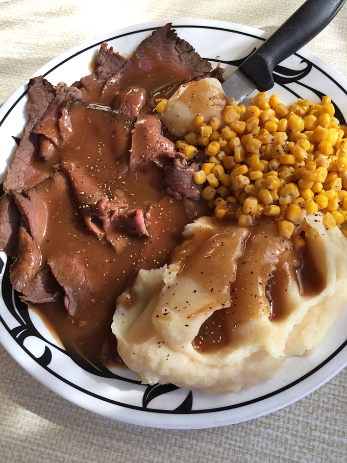 Roast beef dinner with mashed potatoes and gravy—comfort food so perfect it could make a grown adult weep with joy and nostalgia.