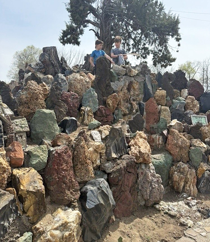 Kids scaling the geological playground, discovering that the best climbing structures aren't manufactured but assembled from nature's own building blocks.