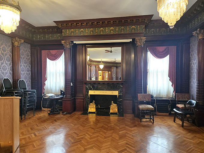 Rich wood paneling and period furniture transform this room into a time capsule where you half-expect a butler to appear with afternoon tea.