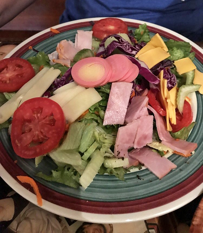 A chef salad that defies the "sad salad" stereotype &ndash; this colorful arrangement of ham, cheese, and fresh vegetables proves healthy can be hearty.