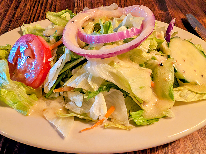 A garden-fresh salad that doesn't apologize for being the opening act before the meat main event. Crisp, colorful, and unapologetically simple.