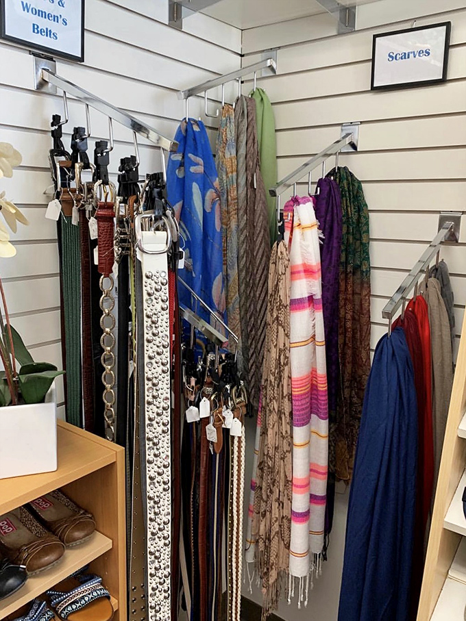 The accessories wall&mdash;where belts and scarves hang like colorful promises of outfit transformations. Fashion math: old outfit + new scarf = new outfit!