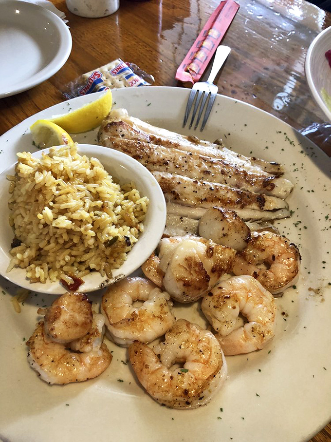 Perfectly grilled shrimp and fish nestled beside seasoned rice &ndash; the kind of plate that makes you wonder why you ever eat anything else.