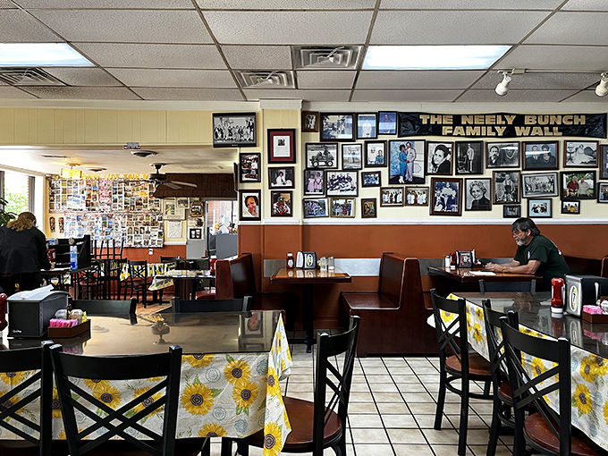The "Wall of Fame" watches over diners like barbecue guardian angels, reminding you that greatness has been consumed in these very booths.