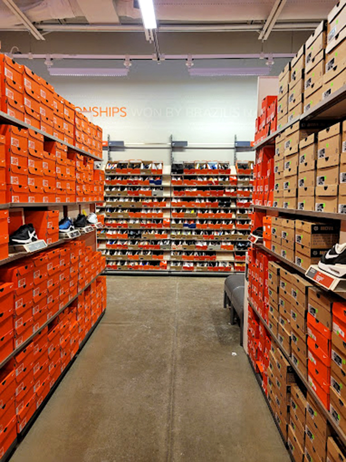 The Nike store's orange box kingdom creates a sneaker wonderland where your feet and wallet engage in their eternal argument about need versus want.