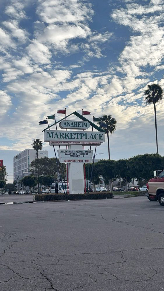 The retro signage stands tall against California's blue sky, a beacon for treasure hunters and food enthusiasts alike.